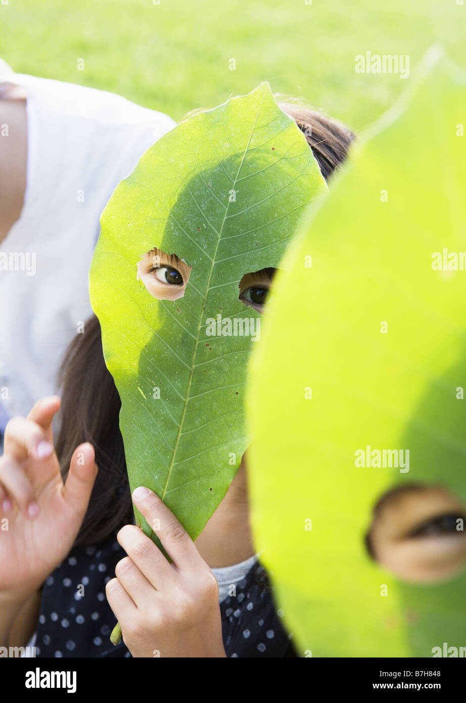 Children with leaf mask Stock Photo - Alamy