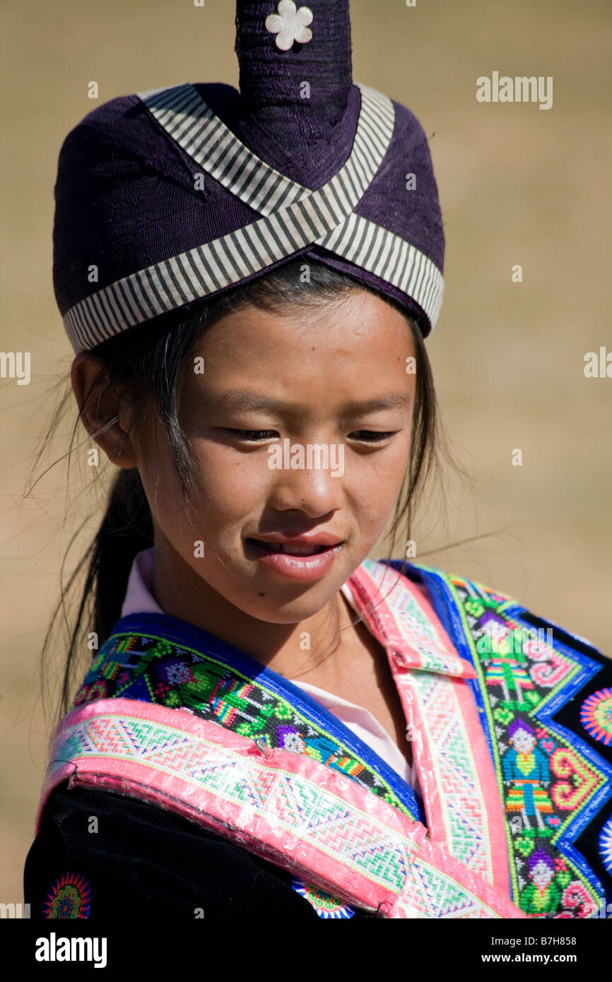 A young Hmong girl in tradional costume at a Hmong New Year celebration ...