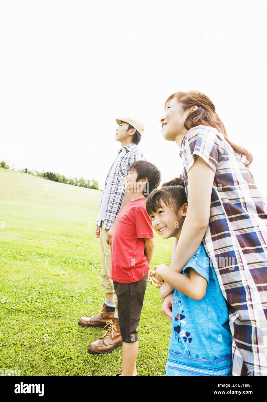Family looking into the distance Stock Photo - Alamy