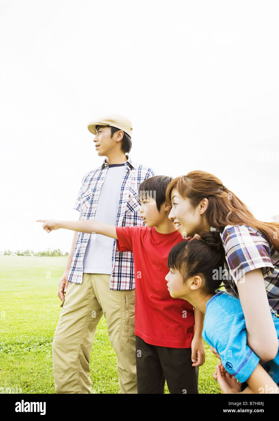 Family looking into the distance Stock Photo - Alamy