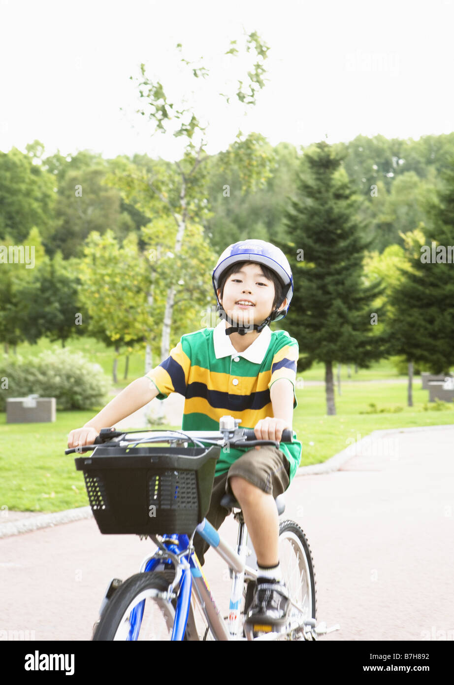 A boy riding a bicycle Stock Photo - Alamy