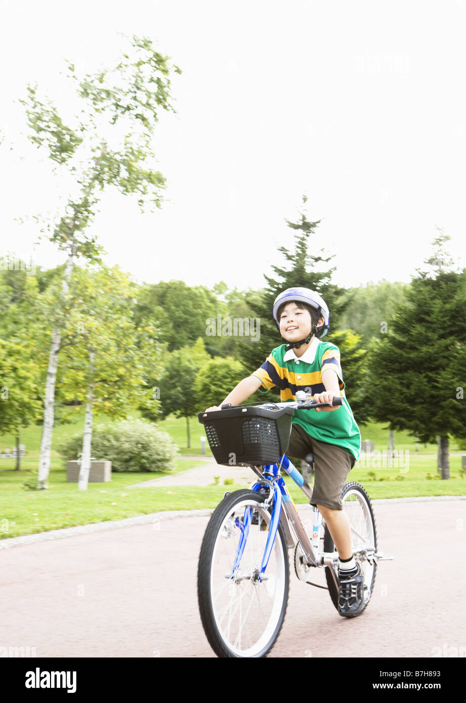 A boy riding a bicycle Stock Photo - Alamy