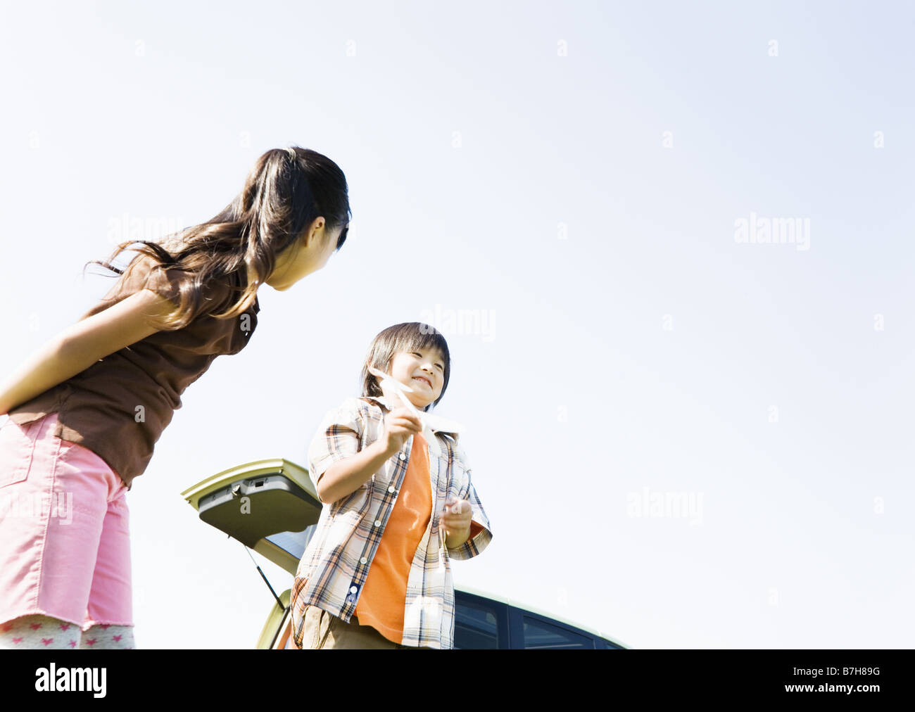 Children playing with toy plane Stock Photo - Alamy