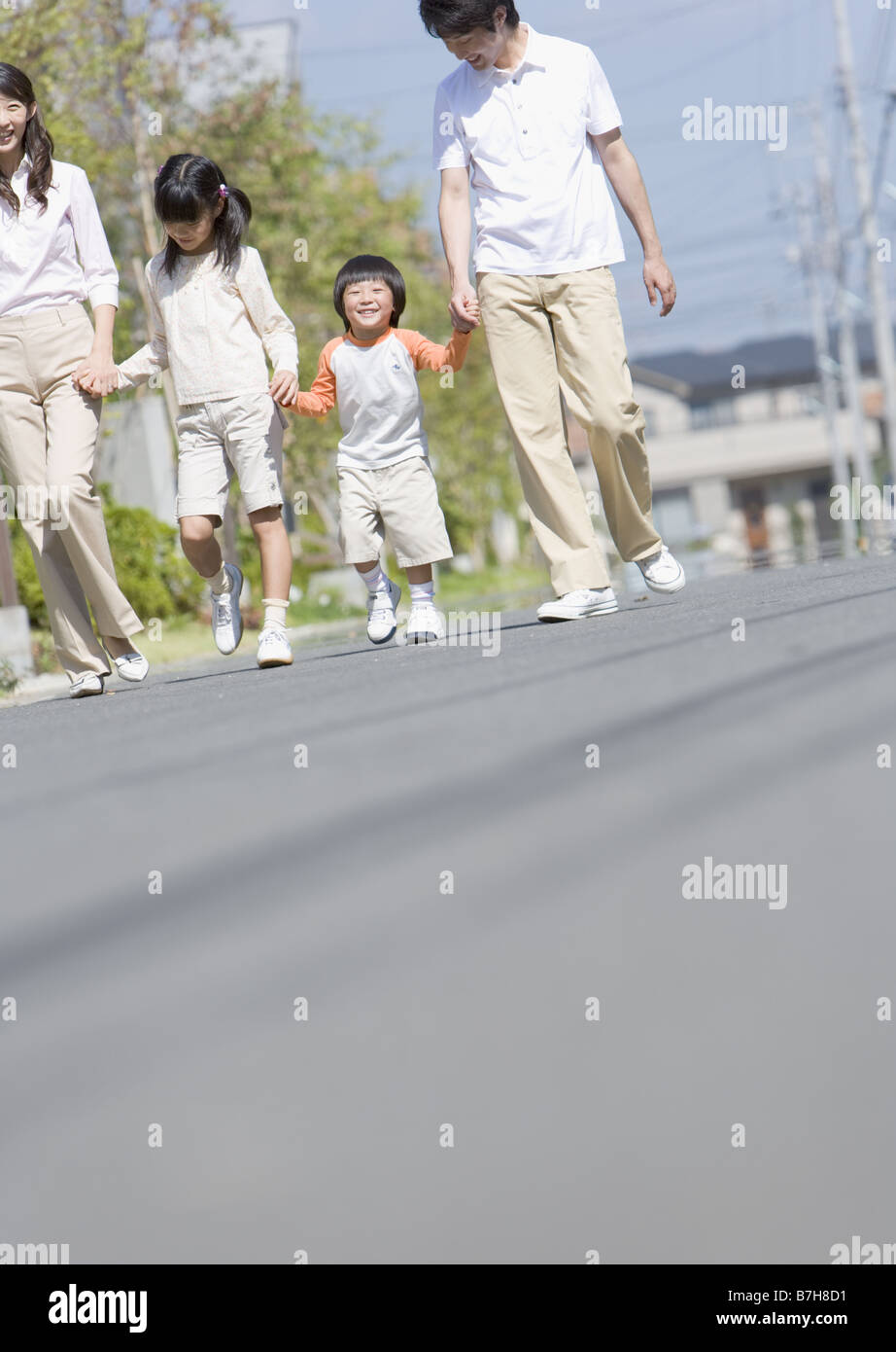 Family taking a walk Stock Photo - Alamy