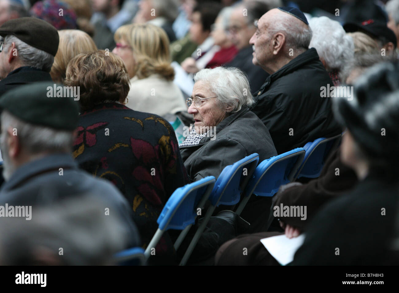 crowds and holocaust survivors watching speeches during the holocaust ...