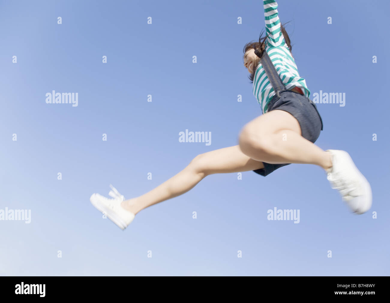 A woman jumping Stock Photo - Alamy