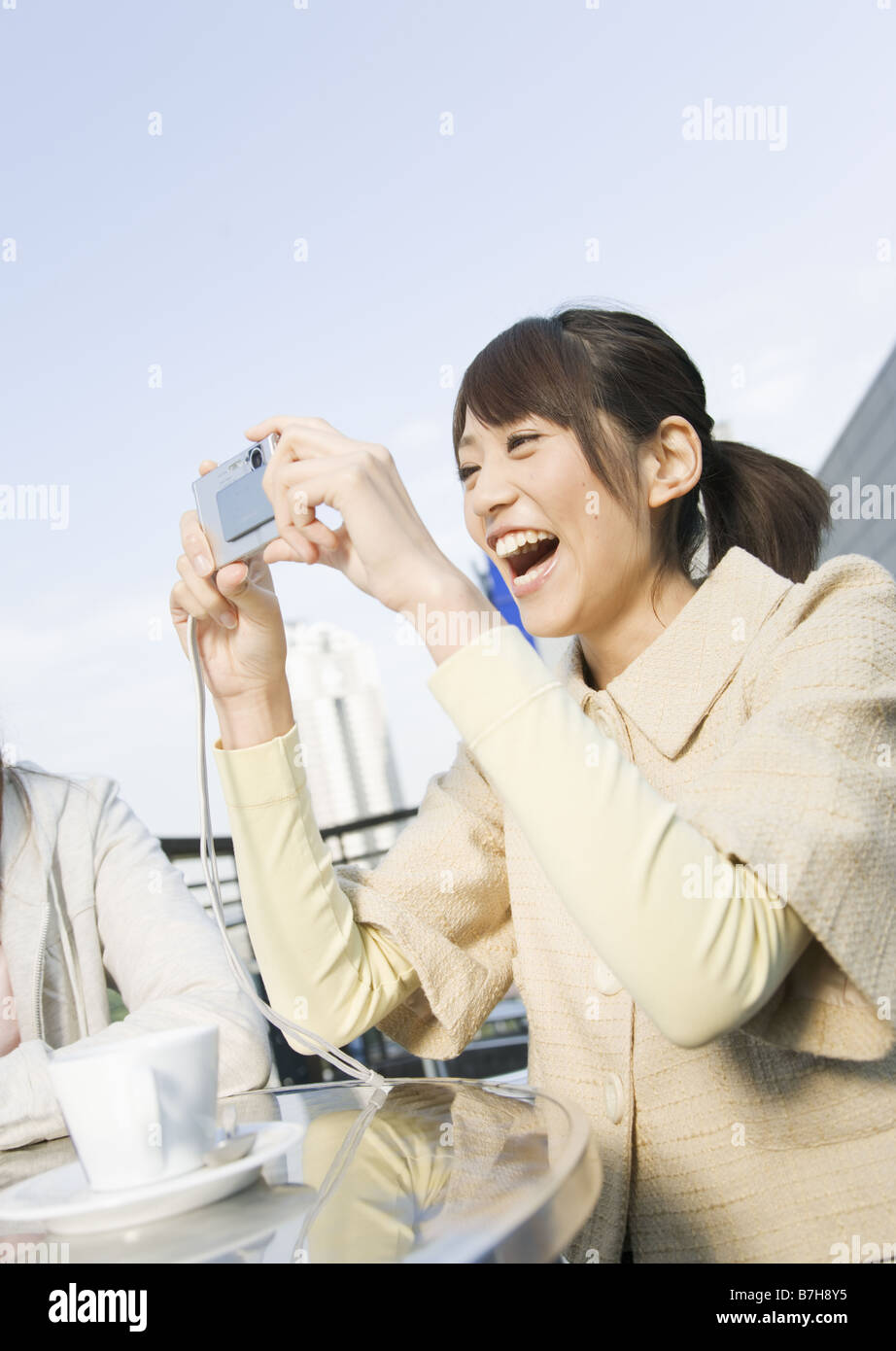 A woman taking a picture Stock Photo - Alamy
