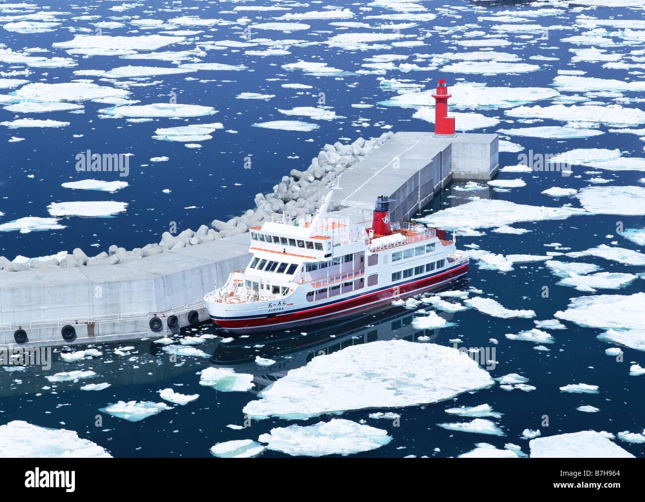 Drift ice and ice breaking ship Stock Photo - Alamy