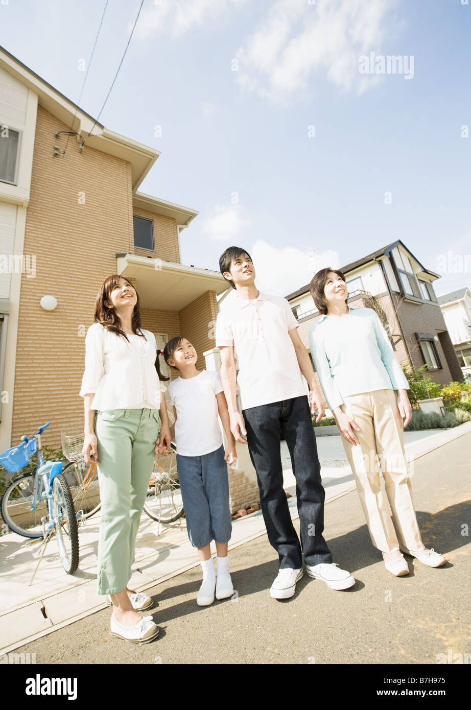 Family looking up at the sky Stock Photo - Alamy