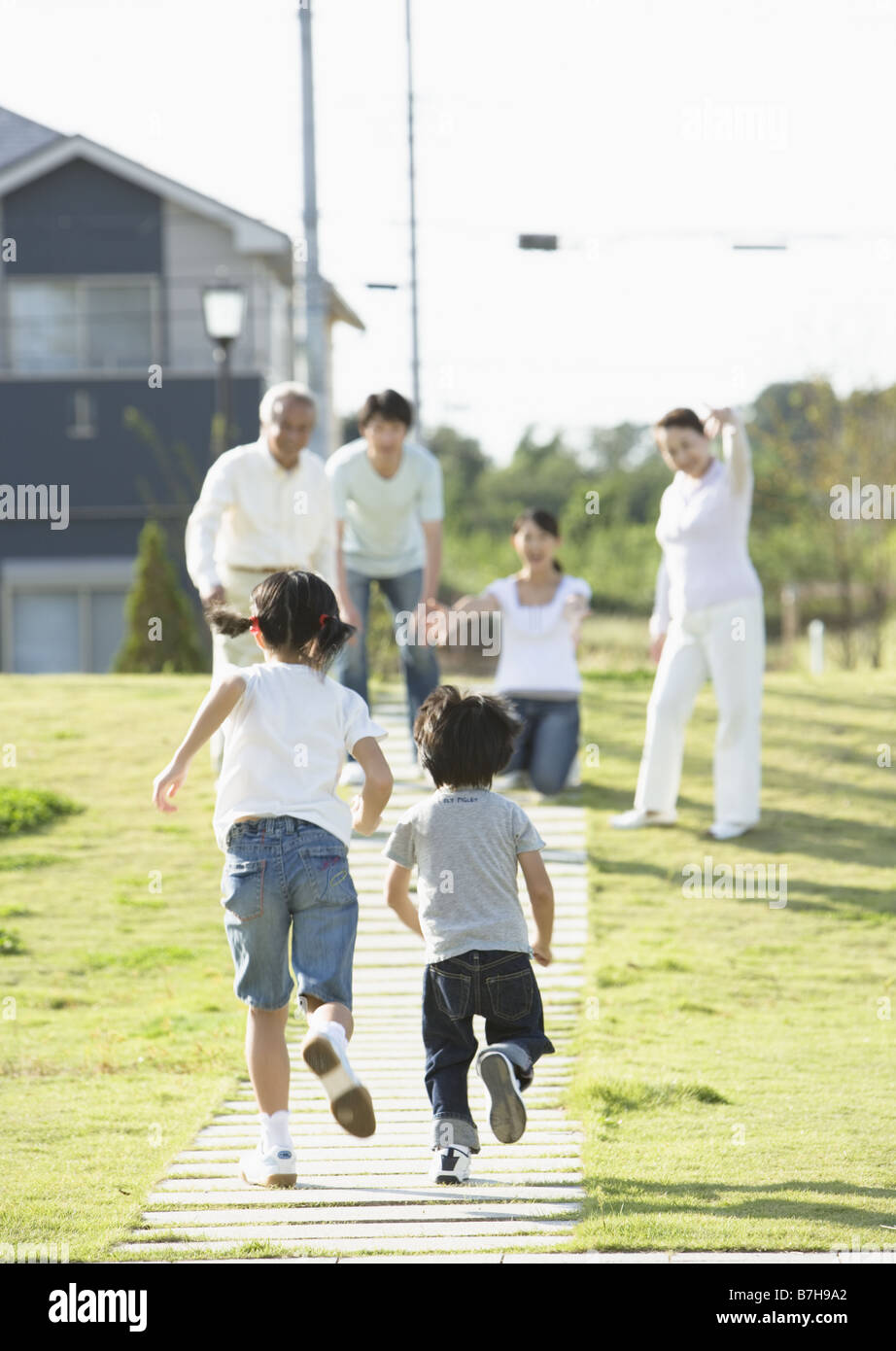 Younger children running hi-res stock photography and images - Alamy