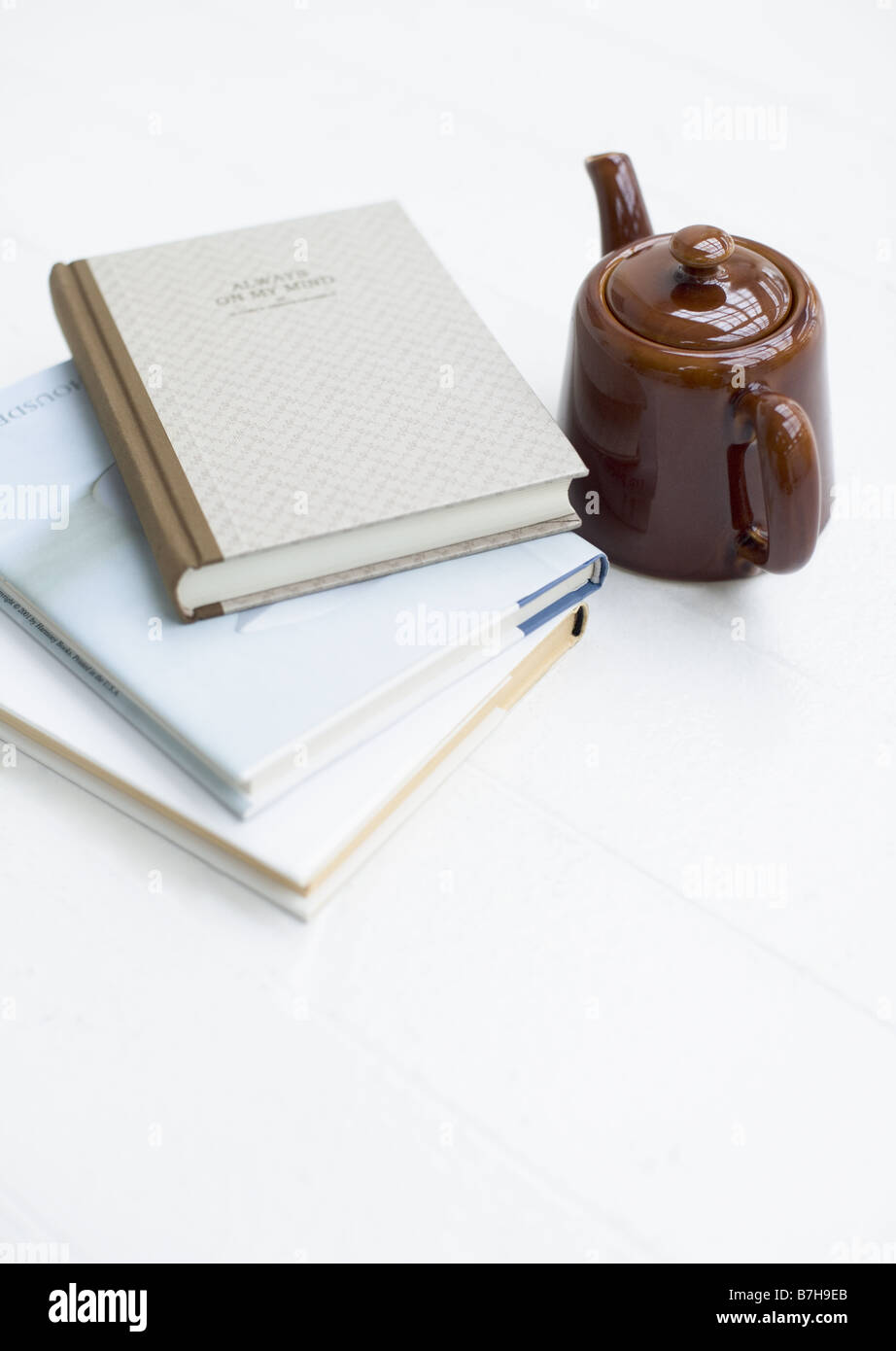 Books and teapot Stock Photo - Alamy