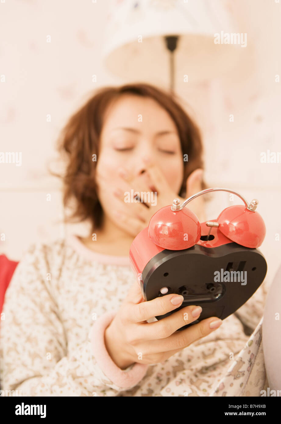 Woman go to bed alarm hi-res stock photography and images - Alamy