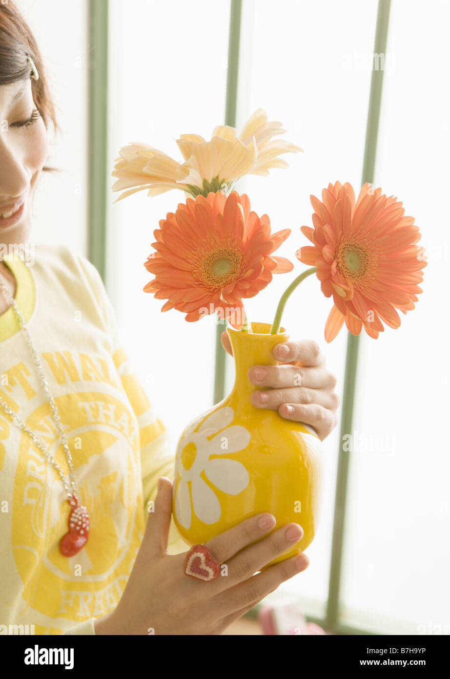 A woman holding vase Stock Photo - Alamy