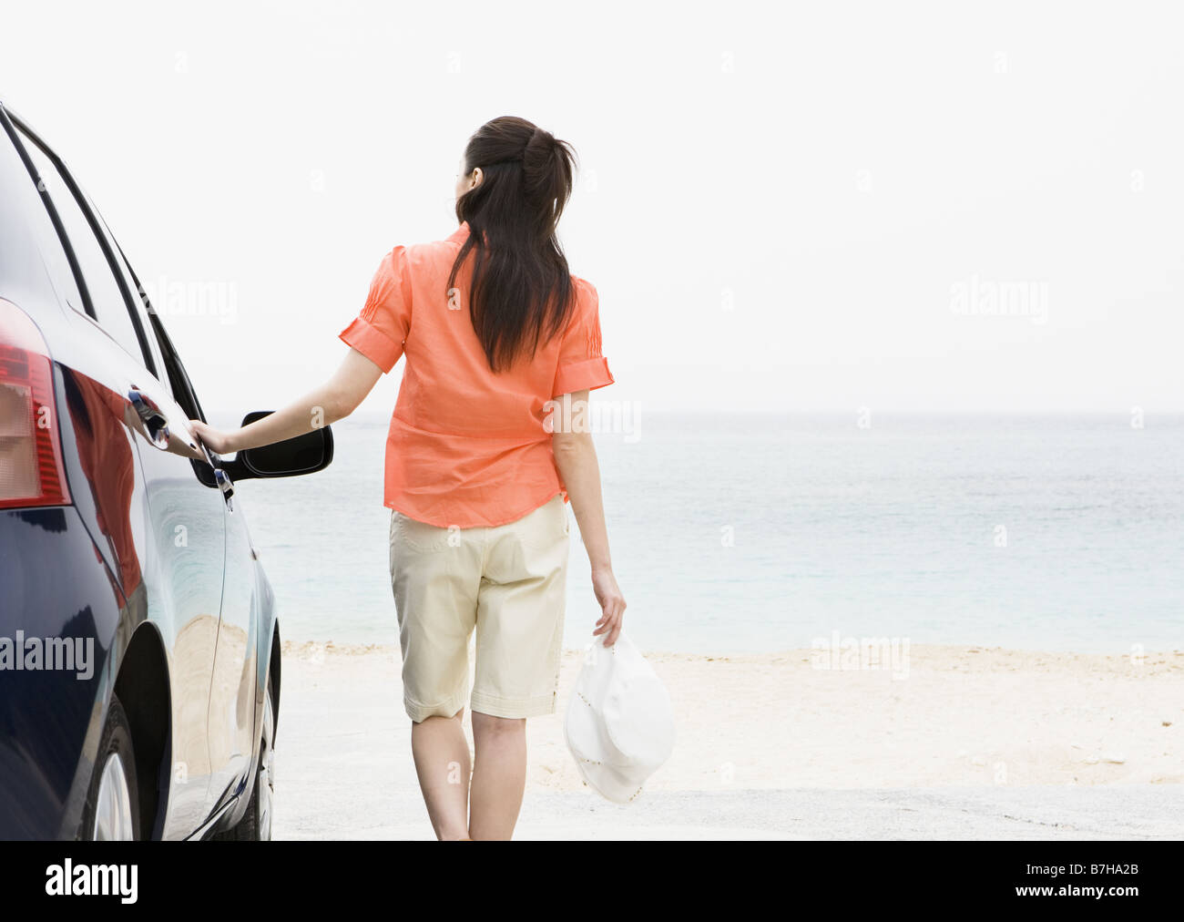 A young woman with a car Stock Photo - Alamy