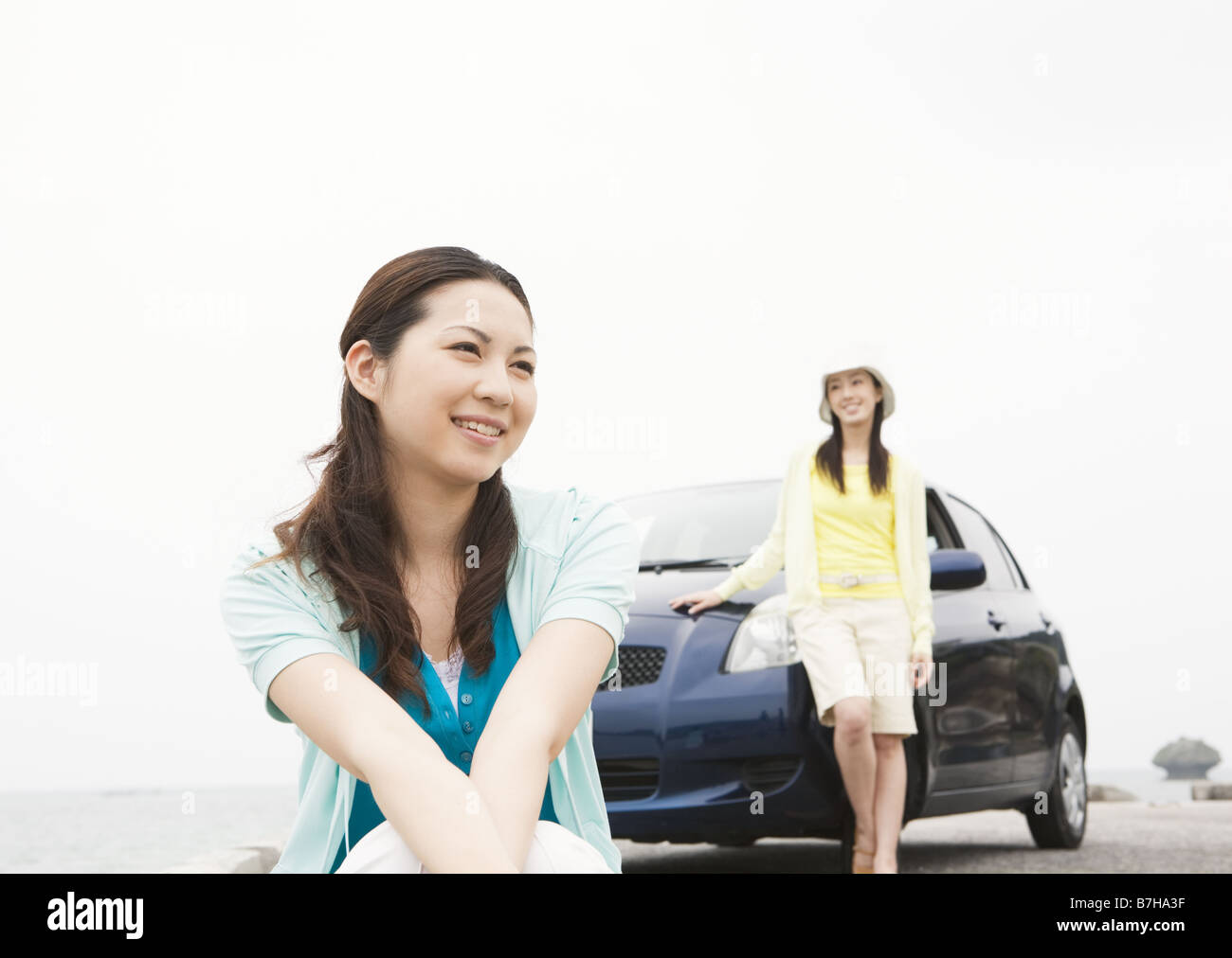 Young women with a car Stock Photo - Alamy