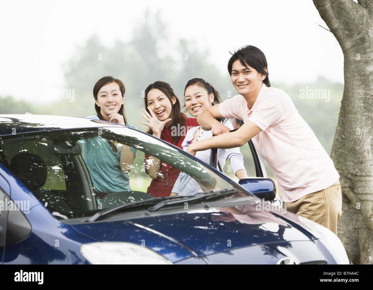 Young people with a car Stock Photo - Alamy