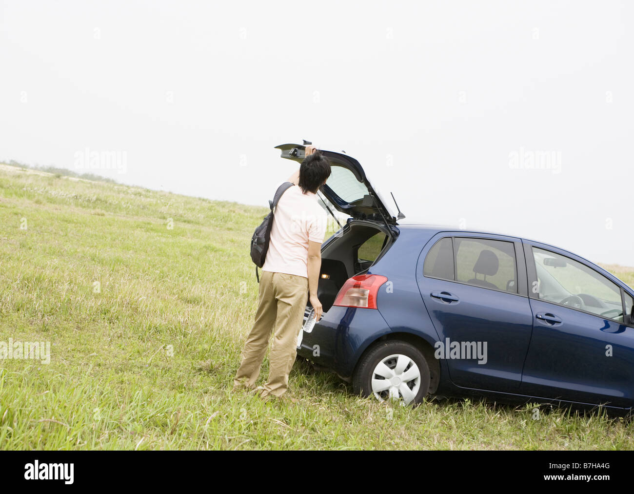 A man opening car door Stock Photo - Alamy