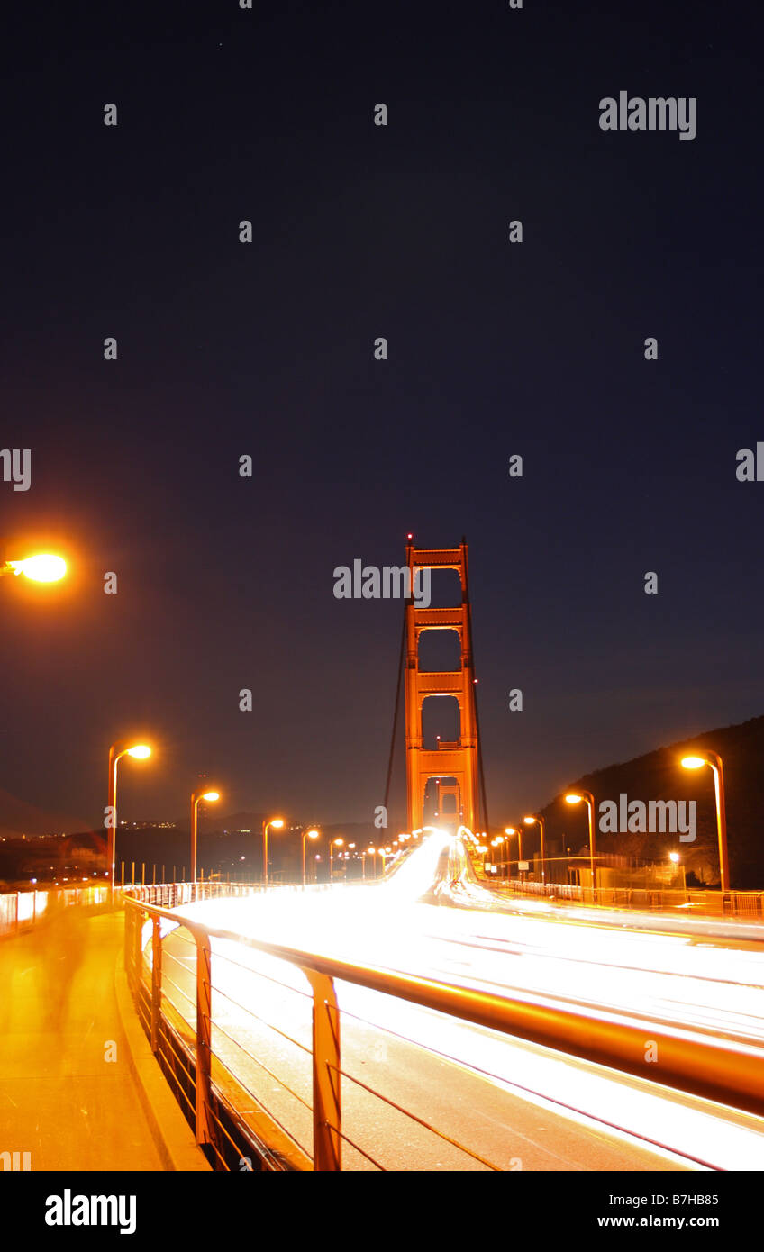 Traffic headlights create light trails on Golden Gate Bridge at San ...