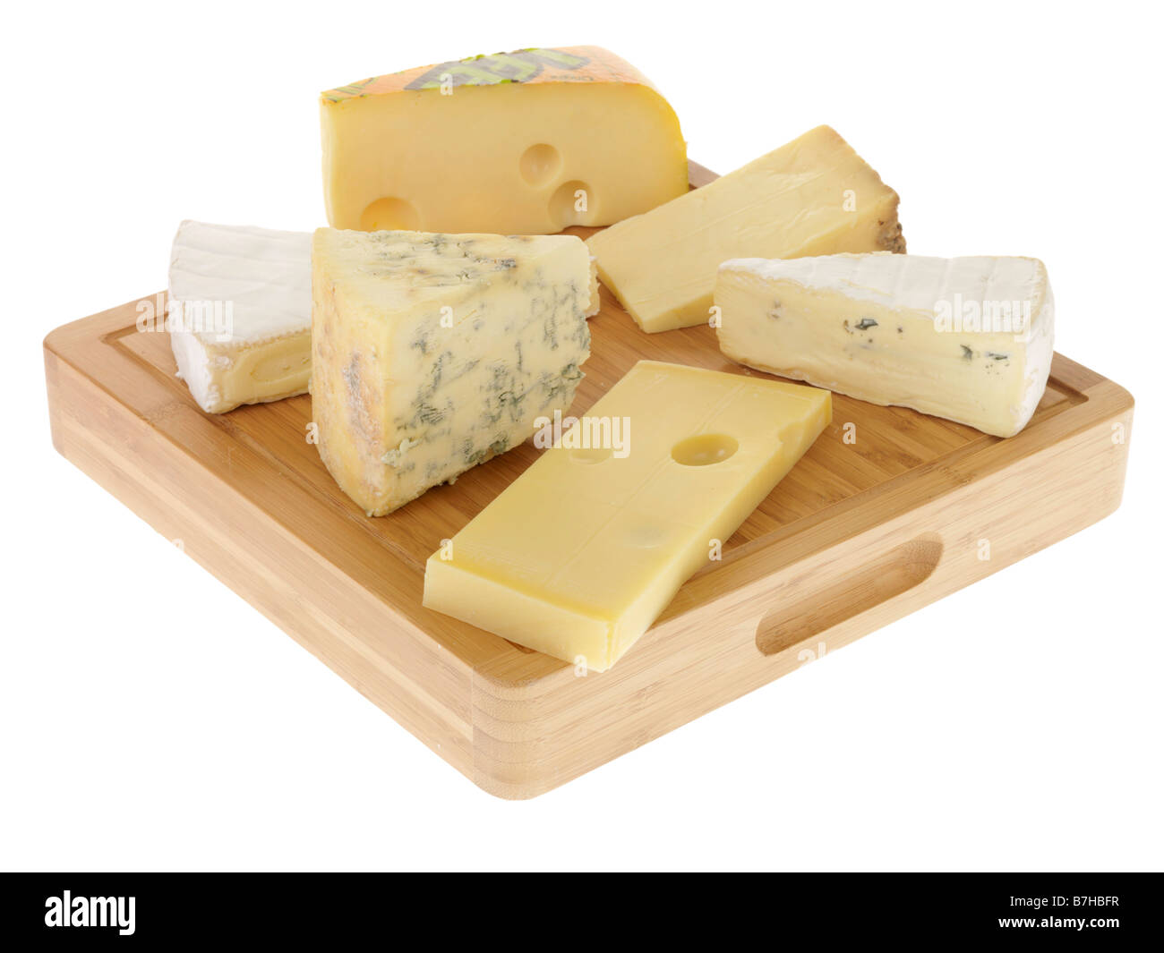 Selection Of Fresh Dessert Cheeses On A Cheese B Isolated Against A ...