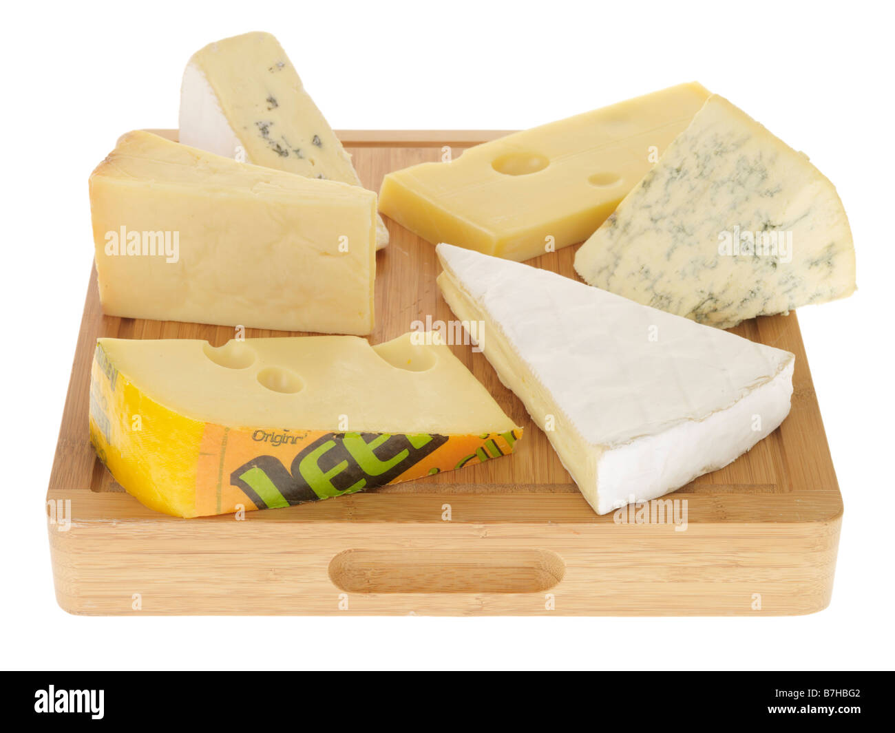 Cut french cheese blocks background Cut Out Stock Images & Pictures - Alamy