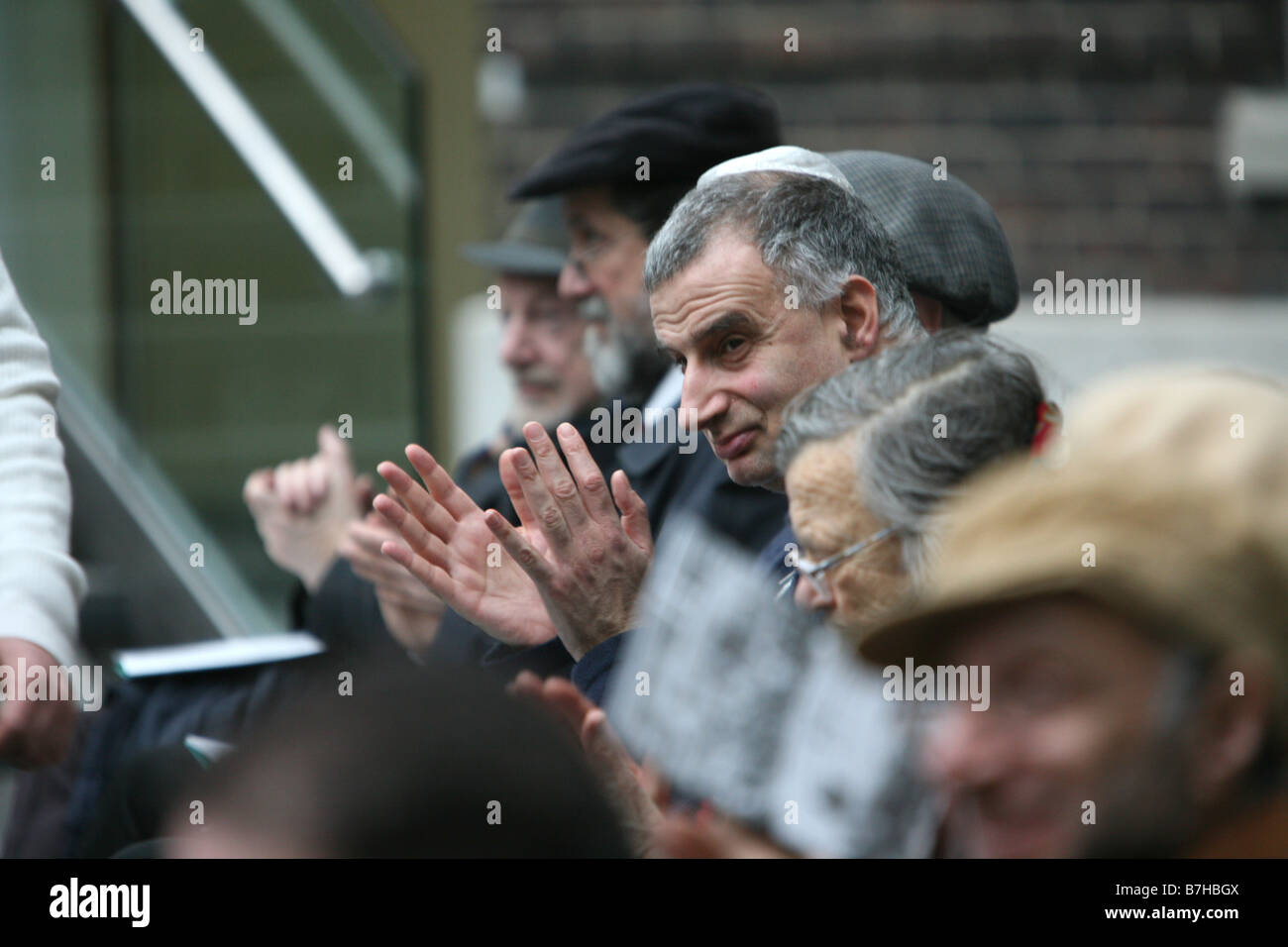 crowds and holocaust survivors watching speeches during the holocaust ...