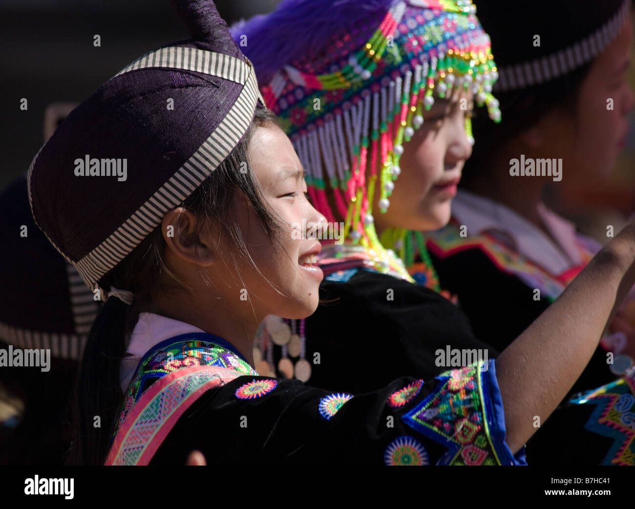 A young Hmong girl in traditional costume at a Hmong New Year ...