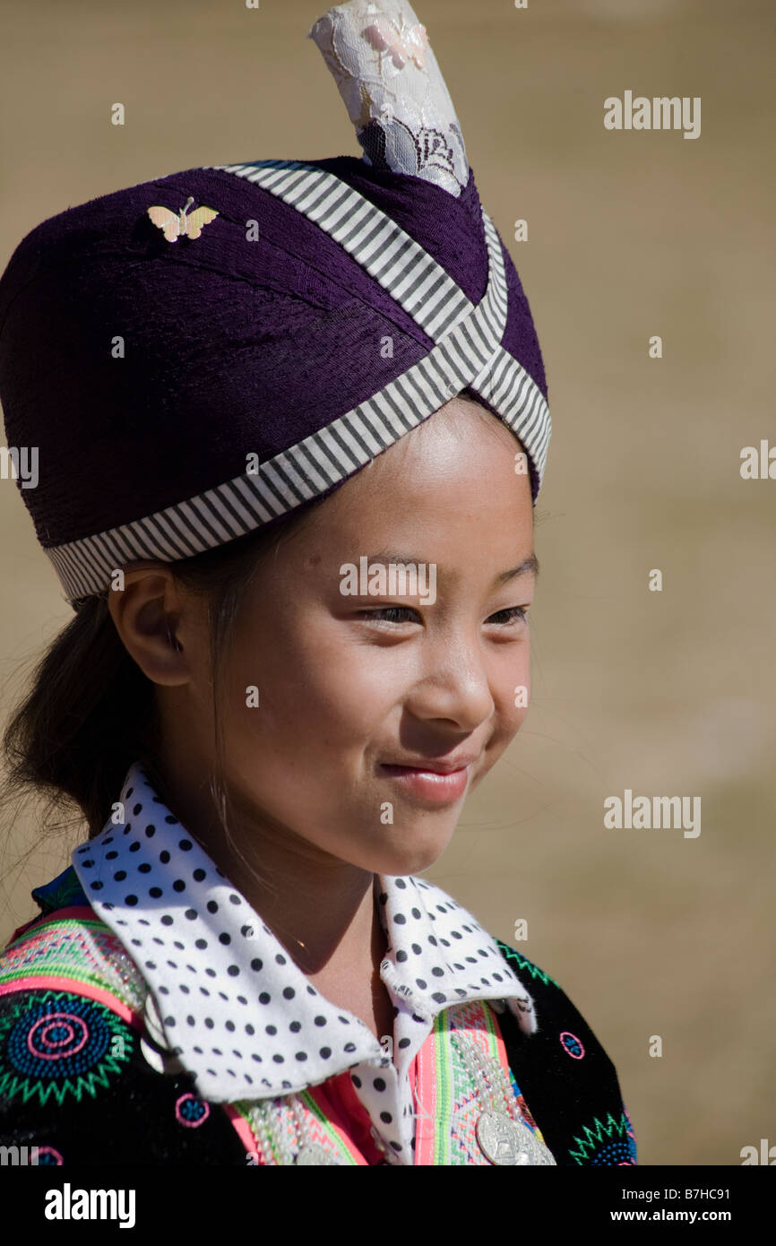 A young Hmong girl in traditional costume at a Hmong New Year ...