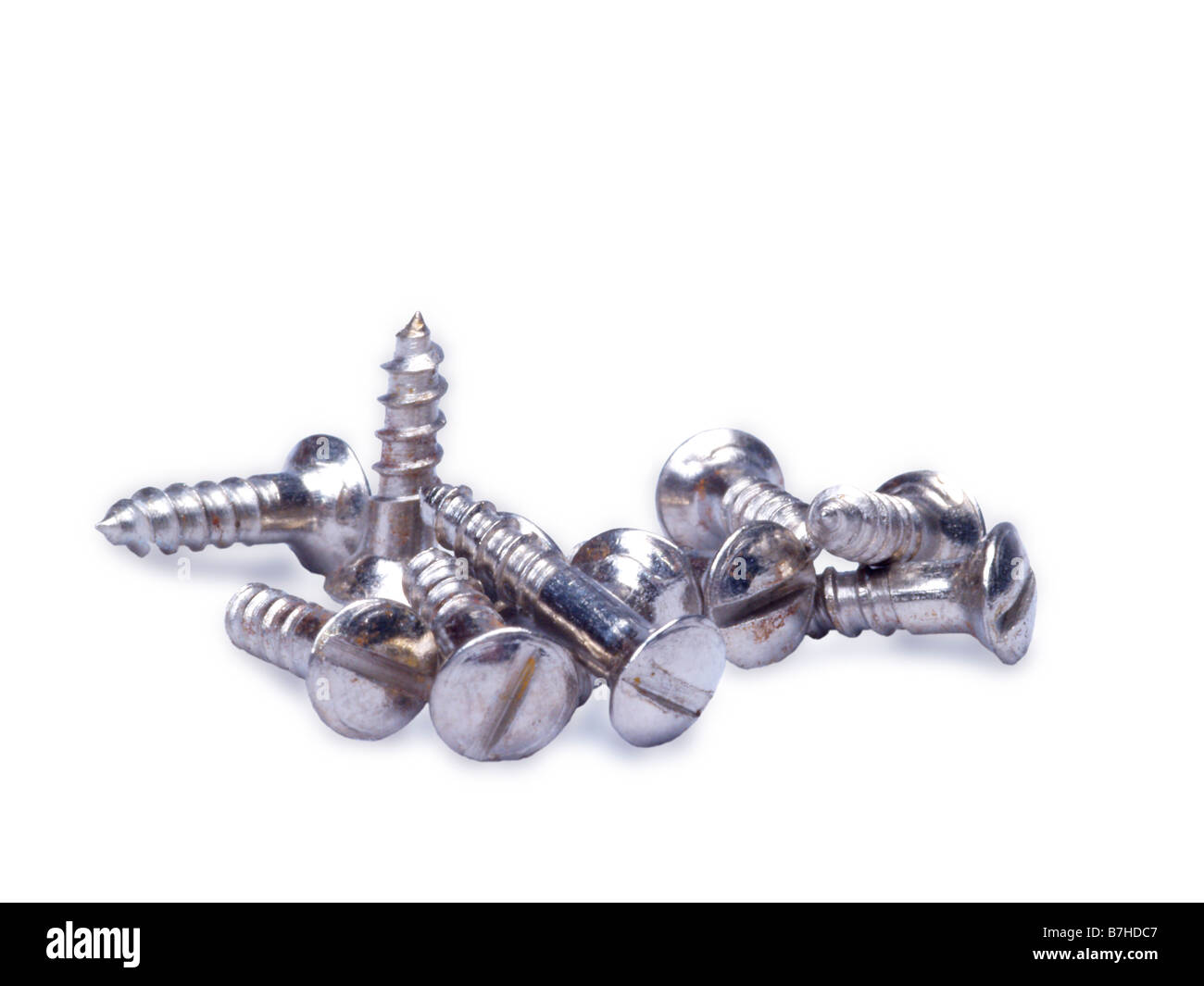 some chrome screws isolated on white background Stock Photo - Alamy