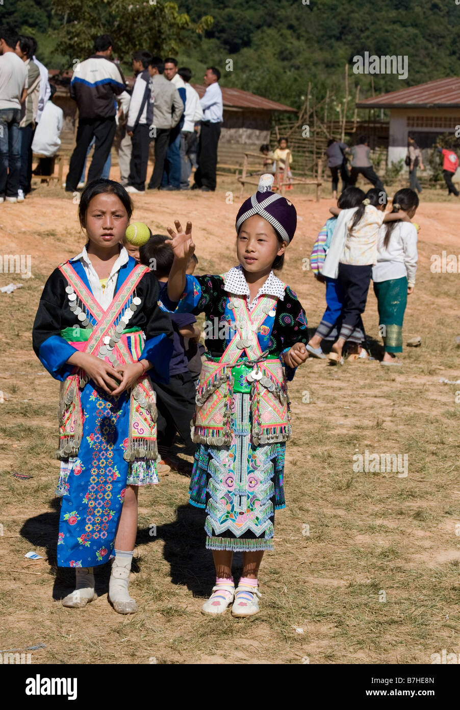 Two young Hmong girls in traditional costume at a Hmong New Year ...