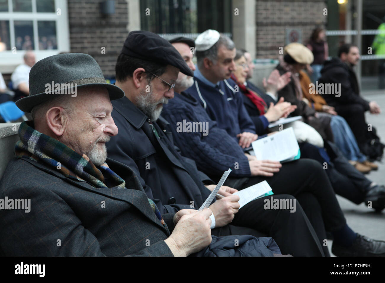 crowds and holocaust survivors watching speeches during the holocaust ...