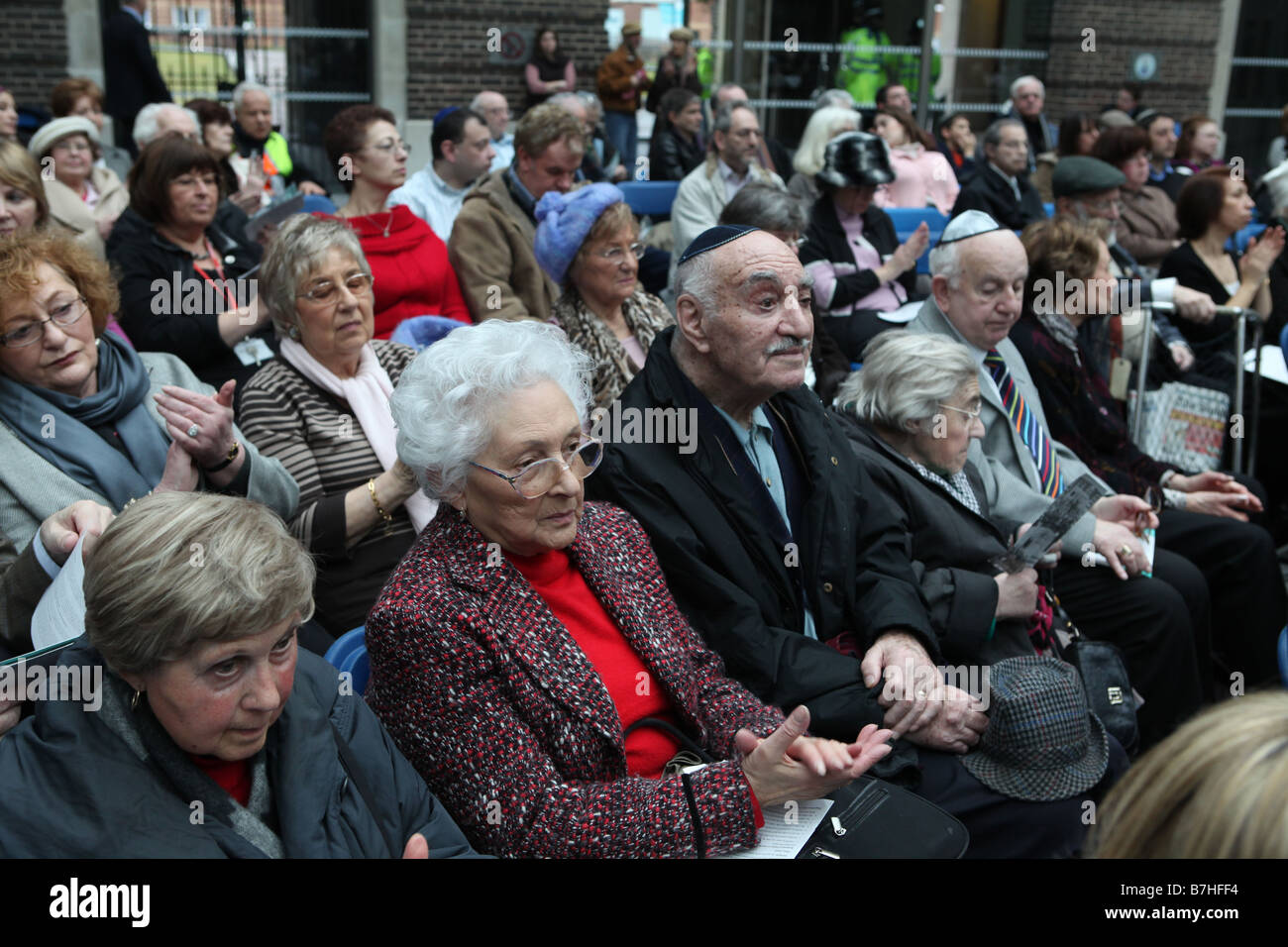 crowds and holocaust survivors watching speeches during the holocaust ...
