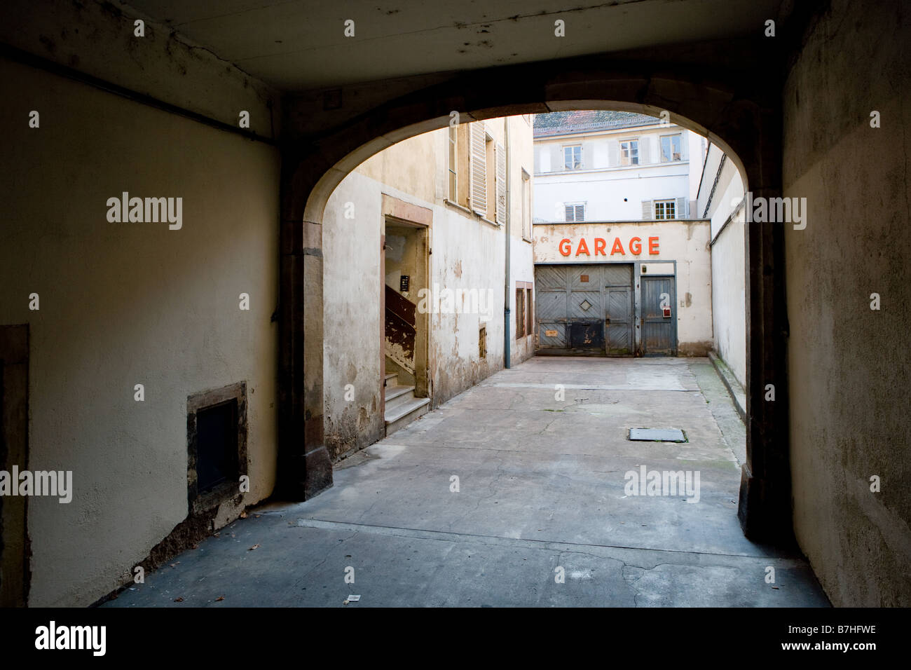 Backyard in the centre of the old town with a garage Stock Photo - Alamy
