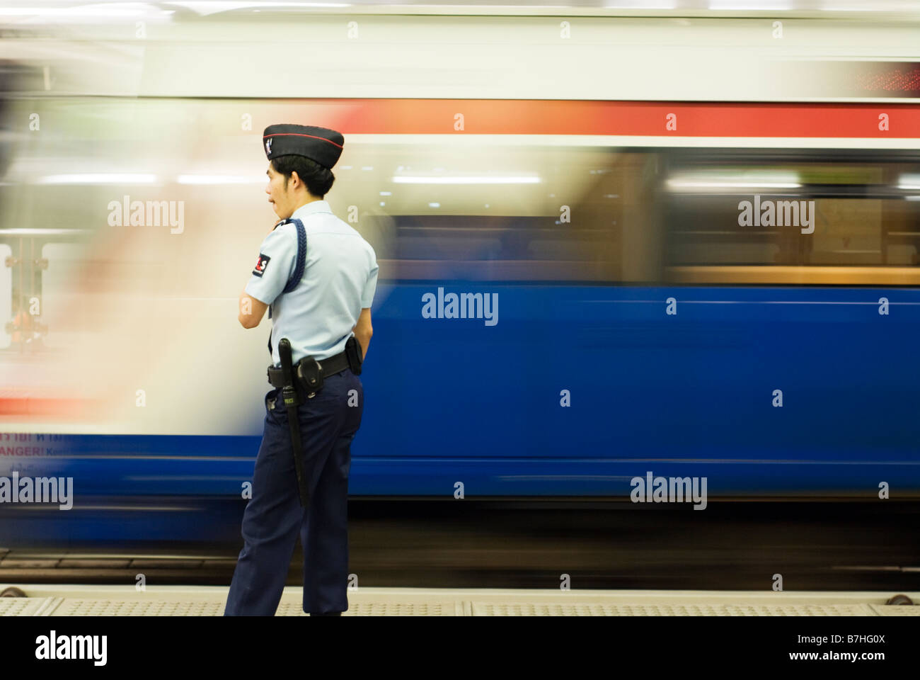BTS sky train and station guard in Bangkok Stock Photo - Alamy