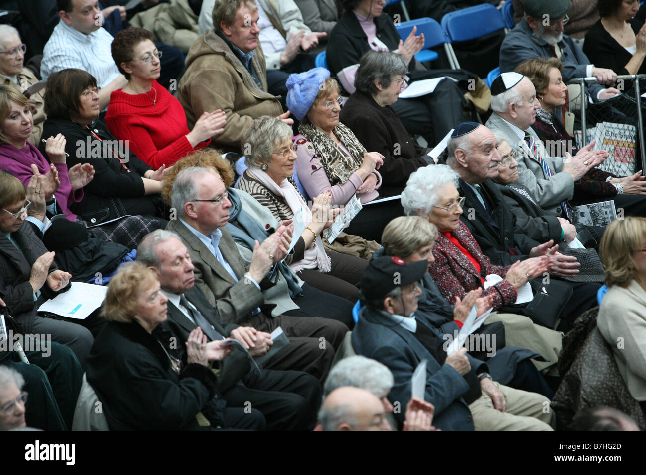 crowds and holocaust survivors watching speeches during the holocaust ...