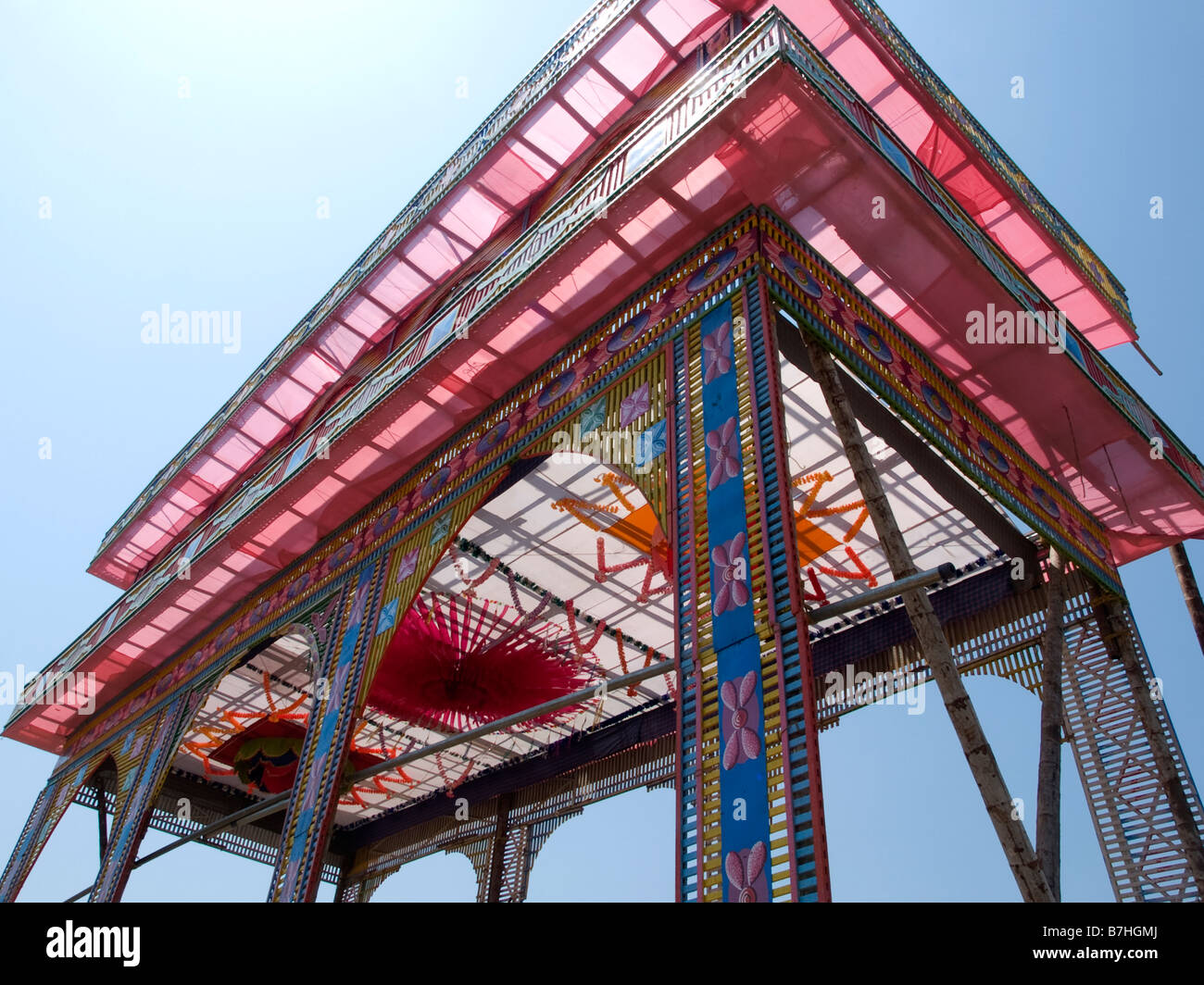 a temporary canopy forms a decorative entrance to an Indian Hindu ...