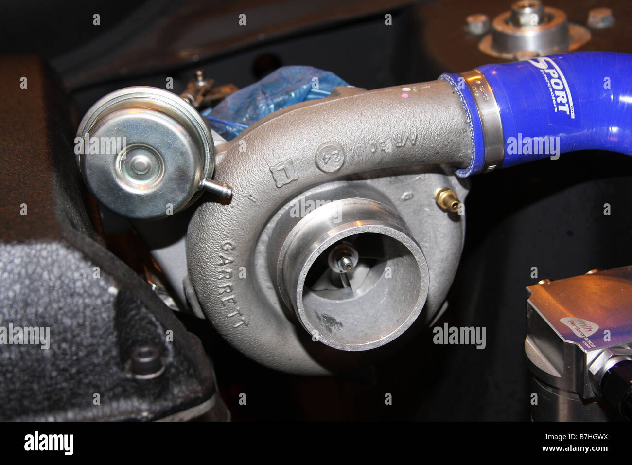 Turbo charger unit fitted to car engine Stock Photo - Alamy