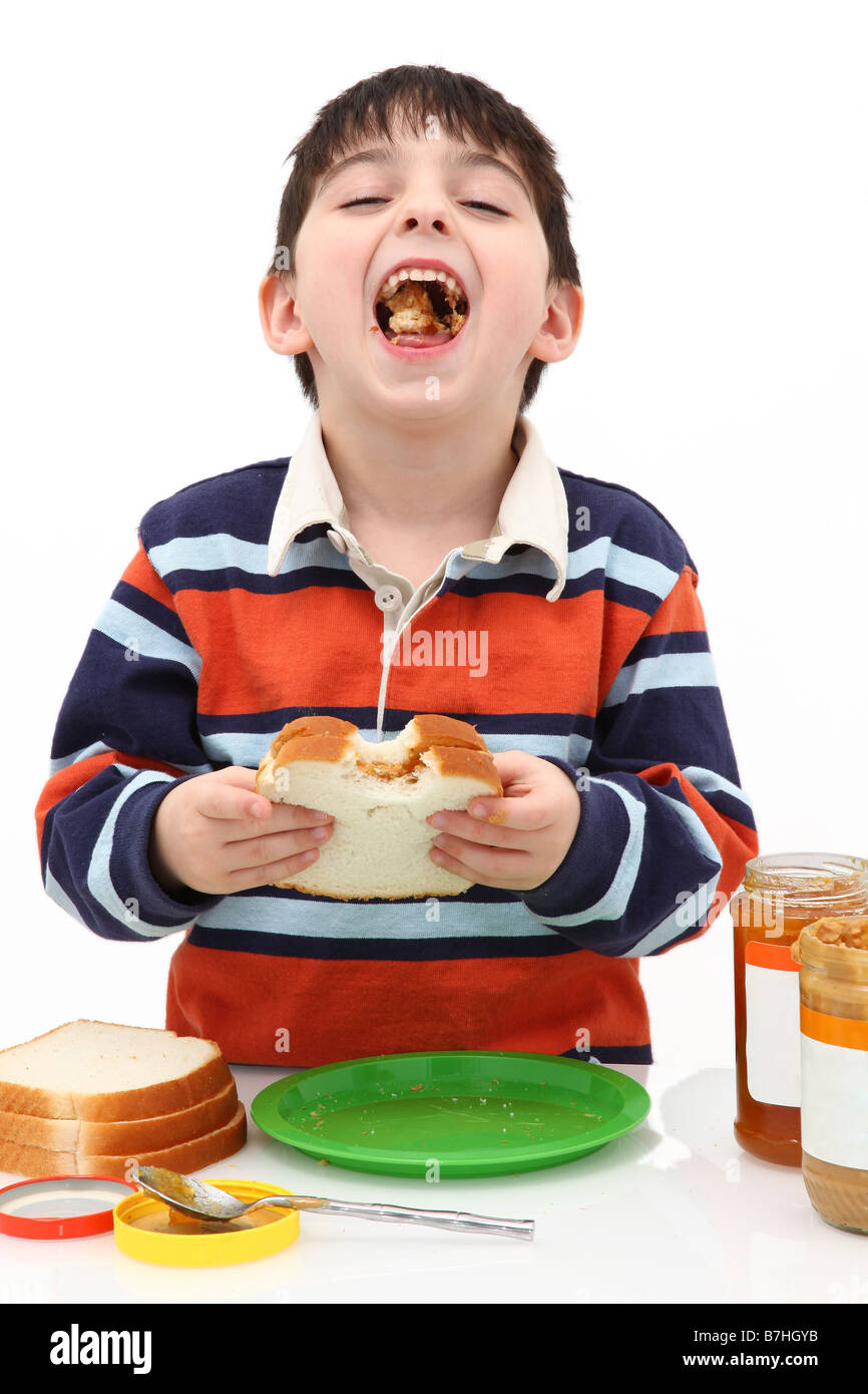 Adorable five year old boy making peanut butter and jelly sandwiches ... Adorable five year old boy making peanut butter and jelly sandwiches ...