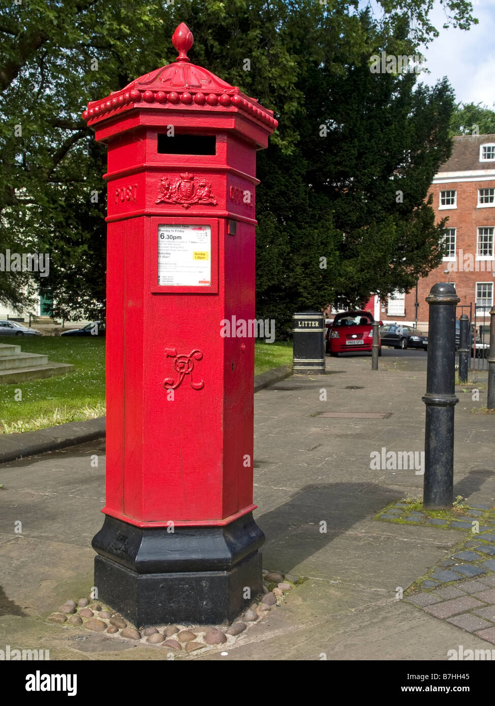 a reproduction Victorian pillar-box stands beside Worcester cathedral ...