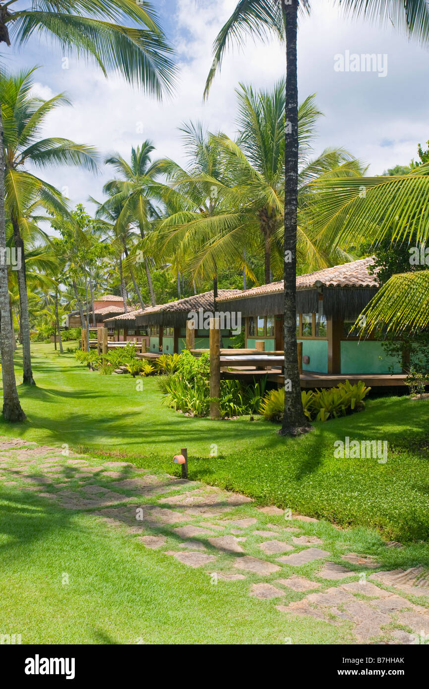 Rustic beach house with wooden veranda among palm trees in Brazil Stock ...