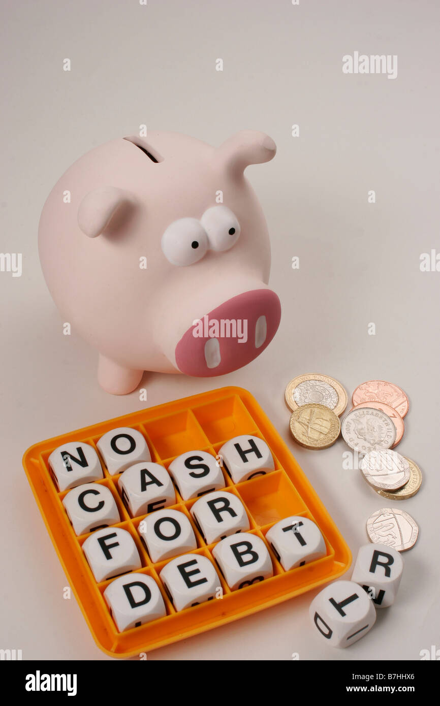 Game words 'no cash for debt' with piggy bank and coins Stock Photo - Alamy