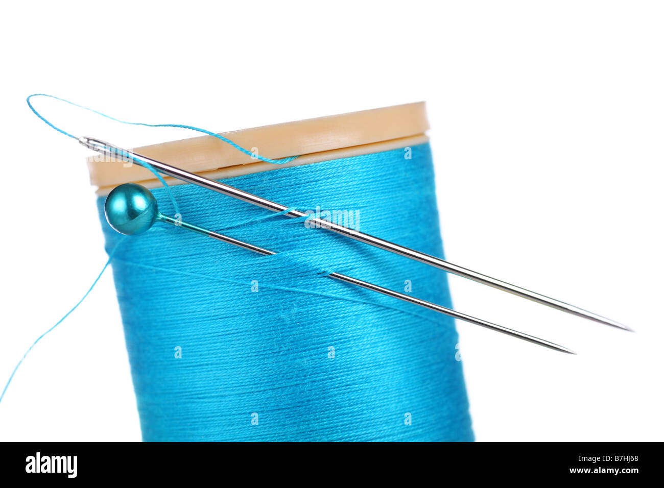 cotton reel with pin needle and thread Stock Photo - Alamy