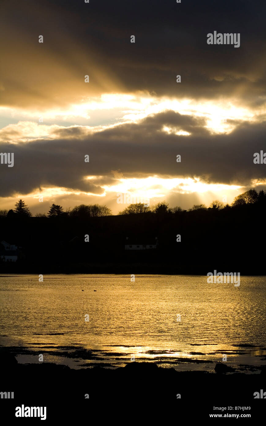 Irish landscape image of dramatic sunset with rays of light coming ...