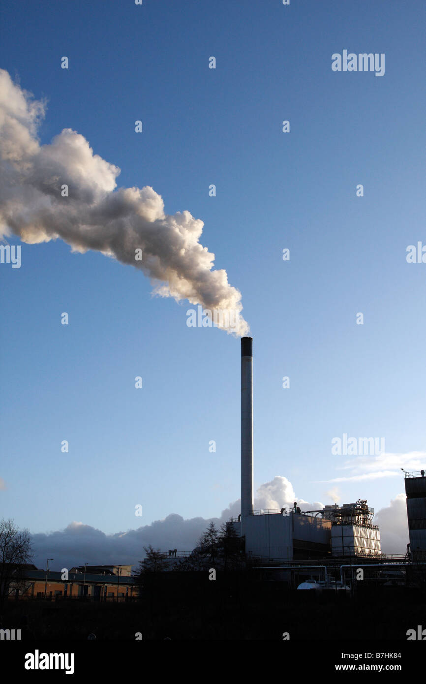 A factory and steam by the River Clyde in the city of Glasgow in ...