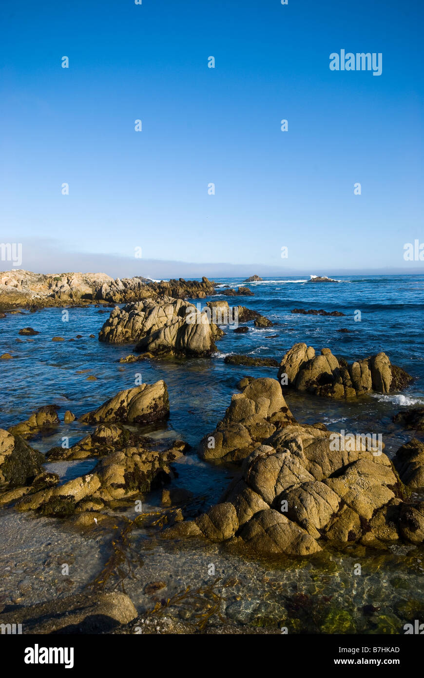 Rocky sea shore with foreground interest Stock Photo - Alamy