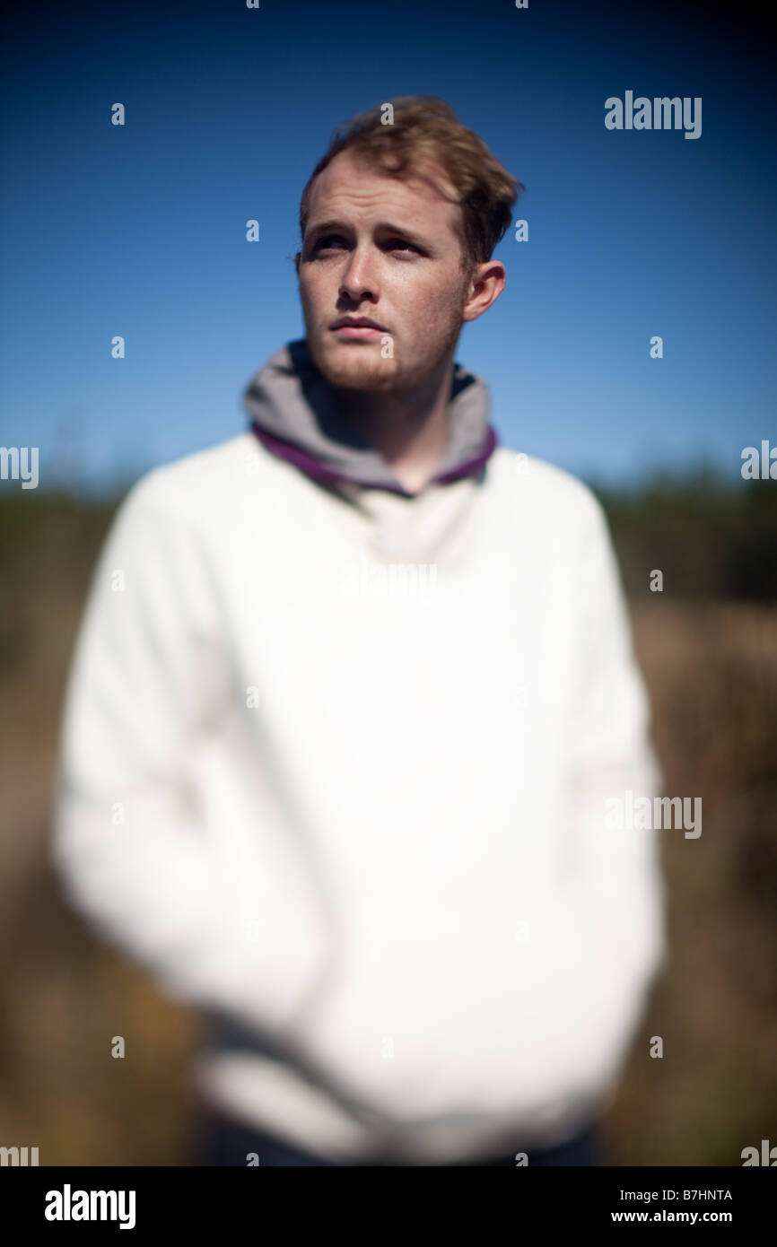 man looking off to the side in a field Stock Photo - Alamy