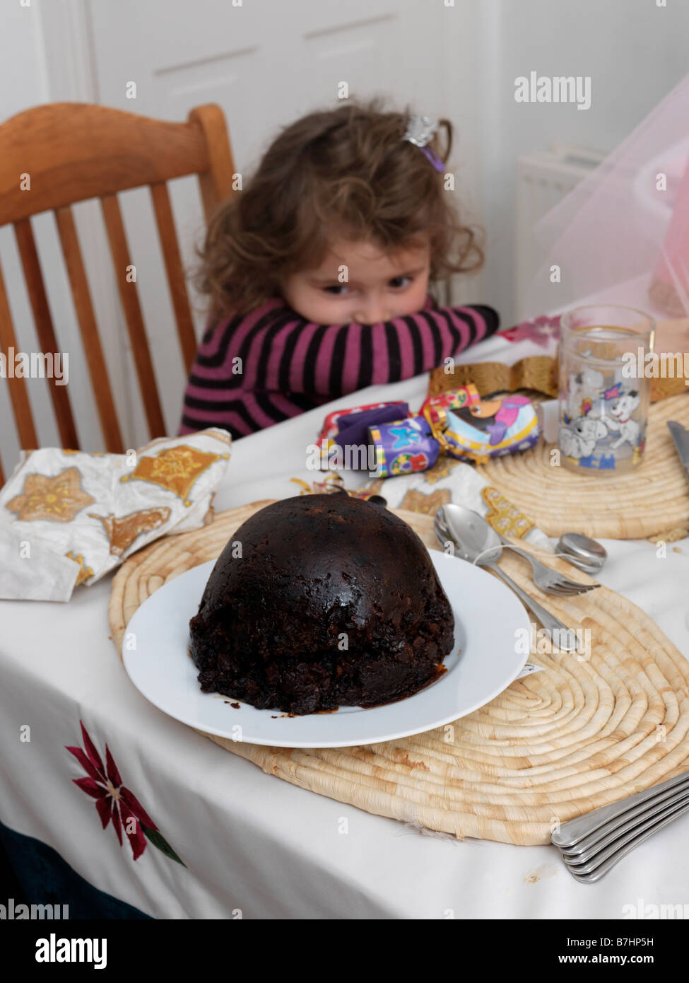 Child Looking at a Christmas Pudding Stock Photo - Alamy
