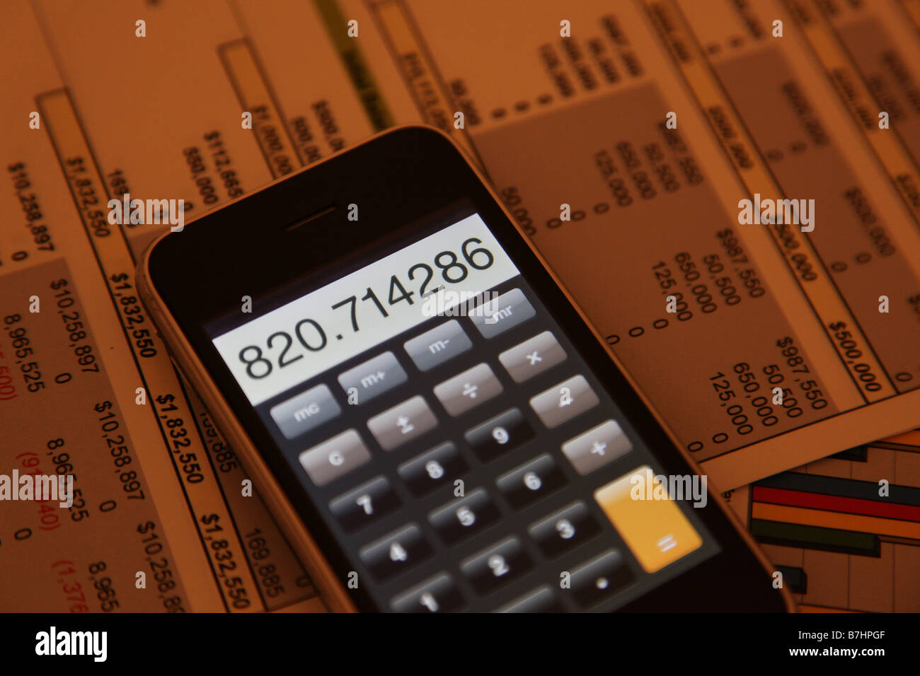 touch screen calculator over financial papers Stock Photo - Alamy