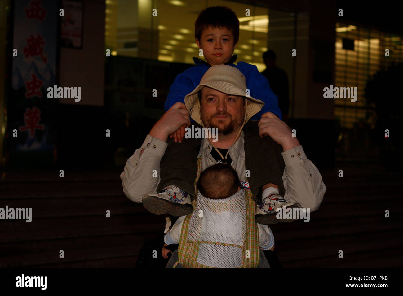 Father with two Children in China Stock Photo - Alamy