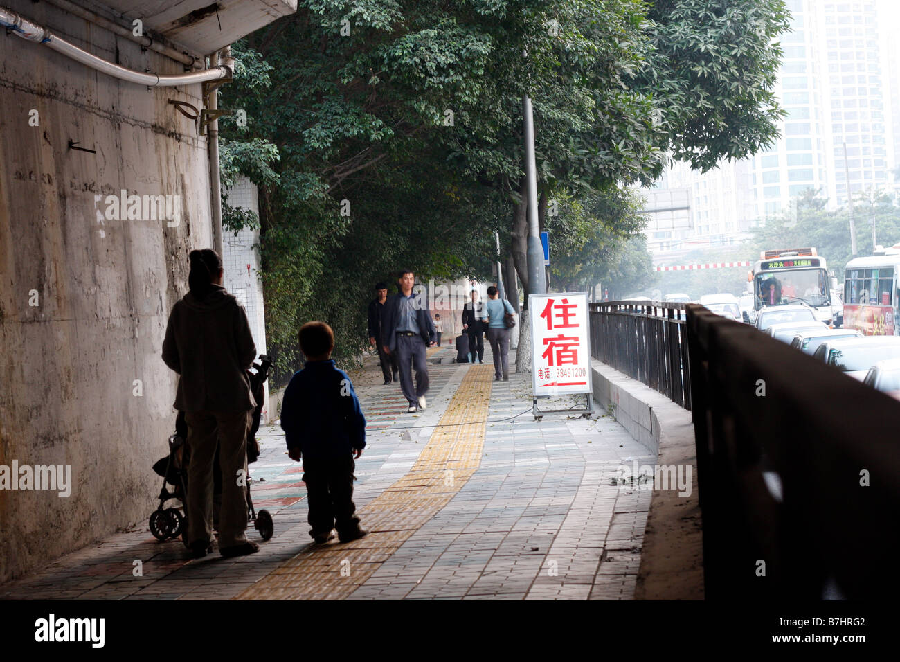 A woman pushing stroller wlking alone with child through tunnel Stock ...