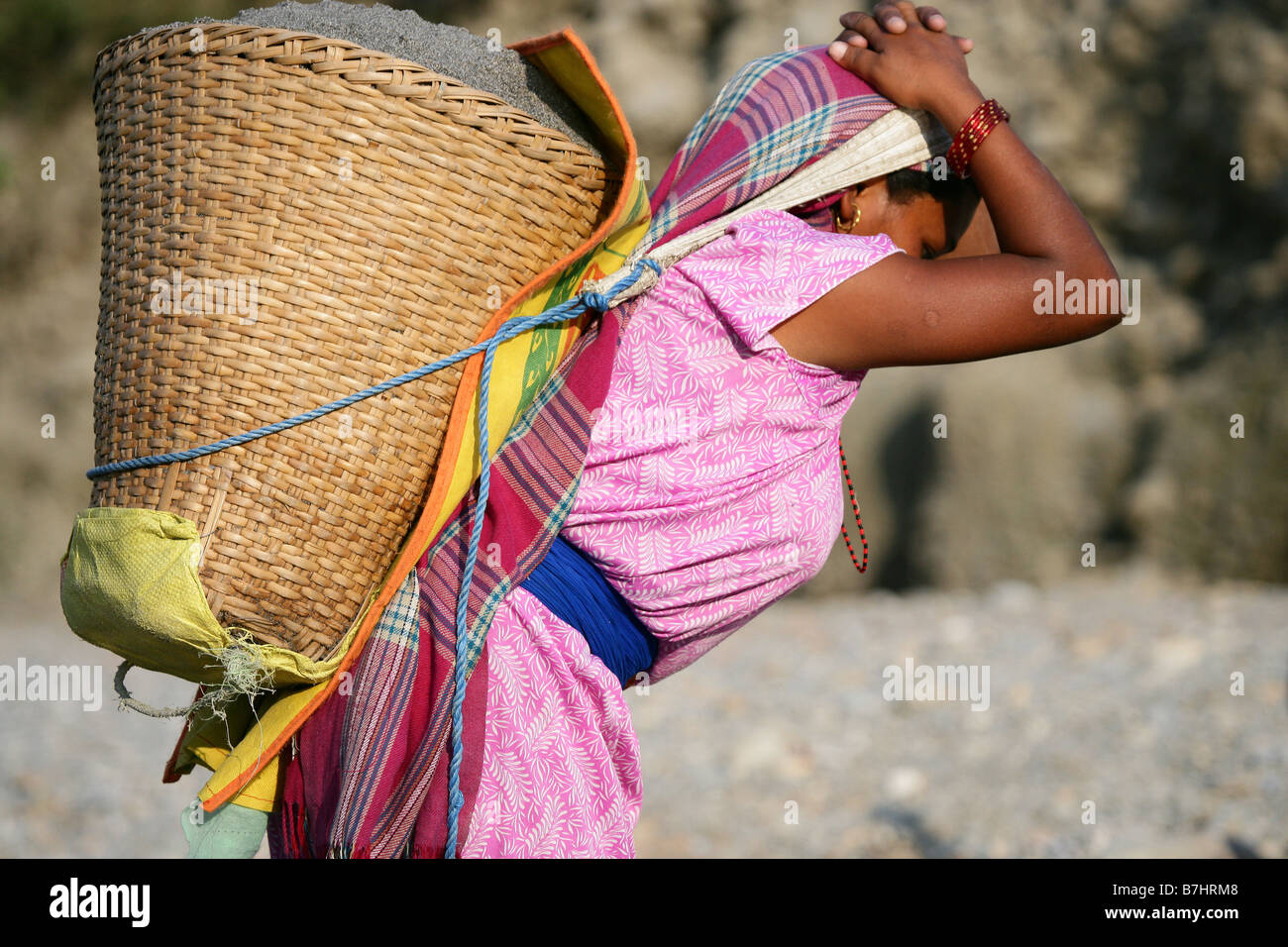 “Children carrying sand in a dhoko” Stock Photo - Alamy